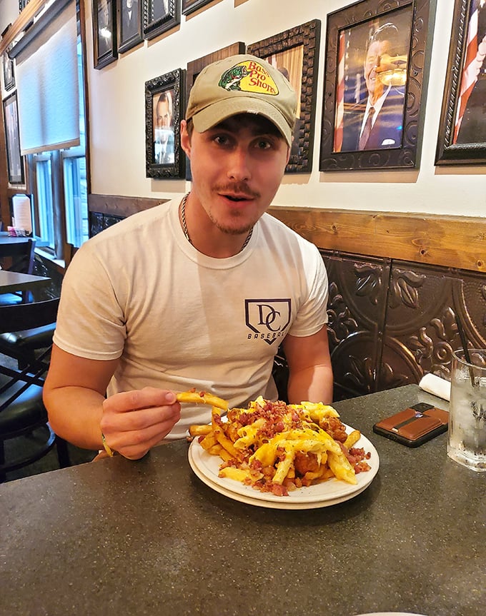 Every great meal has a story. This diner's loaded fries adventure is just beginning, with each cheesy, bacon-topped bite creating a new chapter.