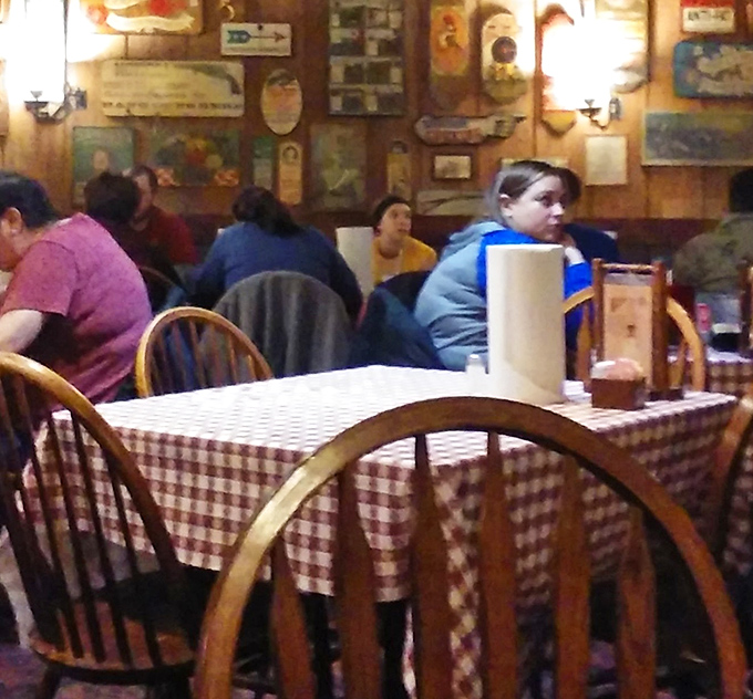 Classic Windsor chairs and checkered tablecloths set the scene for conversations that matter more than whatever's happening on your phone.