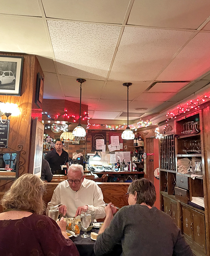 The dining room buzzes with conversation and clinking glasses – the universal soundtrack of a good Italian meal.