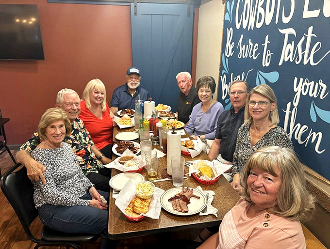 The true measure of great barbecue: the smiles around the table. These folks aren't posing&mdash;they're pausing briefly before diving back in.