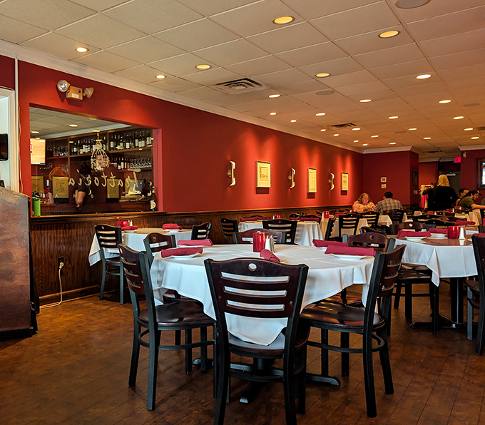 The dining room in full swing, where conversations flow as freely as the Chianti being poured nearby.