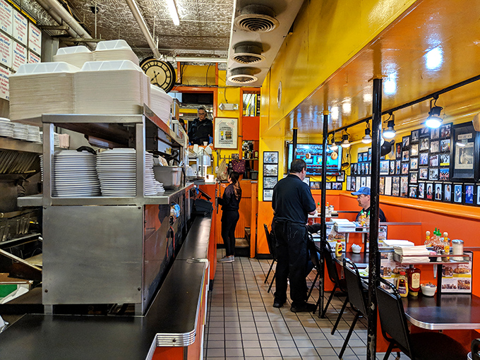 Behind the scenes at Chick & Ruth's, where the narrow kitchen corridor somehow produces enough food to feed half of Annapolis on any given morning.