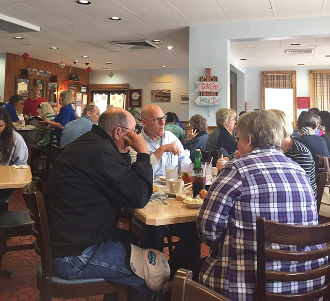 The dining room hums with the universal language of good food – forks pausing mid-air as conversations flow between bites of seafood bliss.