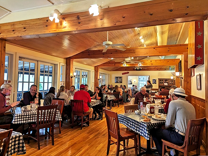 The dining room hums with the symphony of Southern dining—forks clinking, conversations flowing, and the occasional reverent silence when the food arrives.