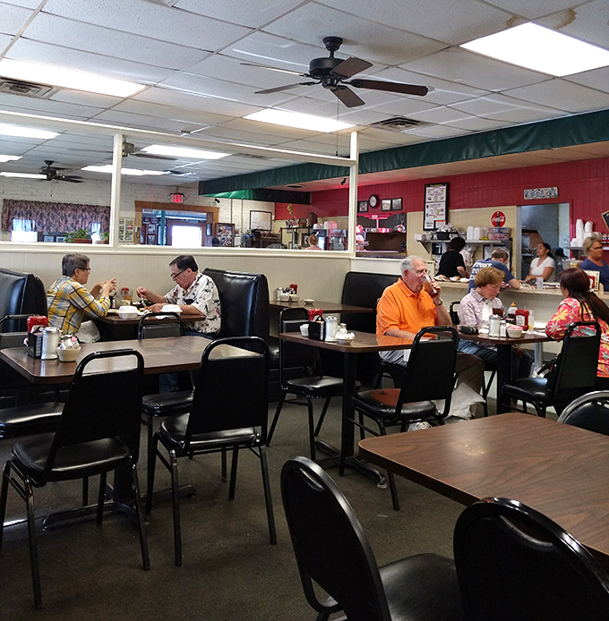 Regulars sharing stories over breakfast, proving good food creates lasting community bonds everywhere.