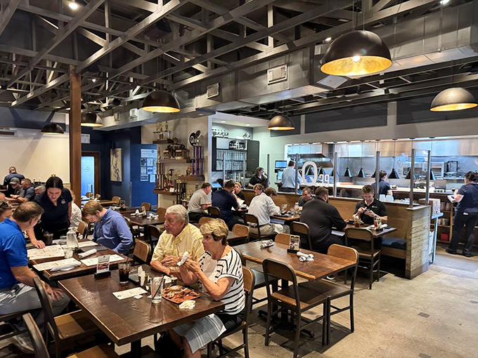 The dining room hums with the universal language of "mmm." Notice how nobody's looking at their phones? That's the power of proper barbecue.