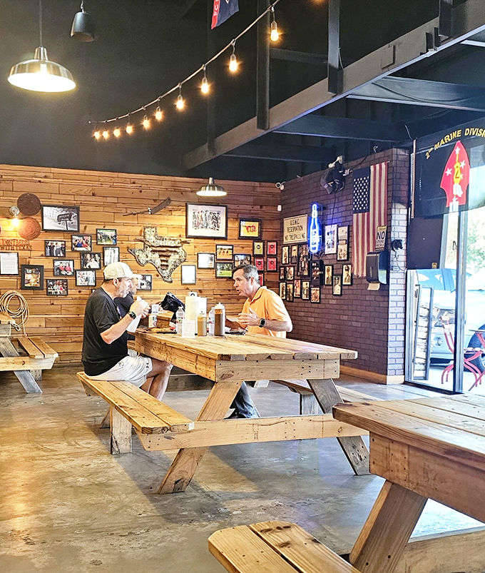 The communal dining experience turns strangers into friends, united by the universal language of exceptional barbecue.