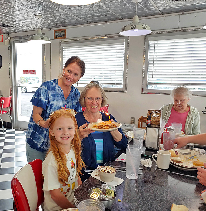 Happy faces around comfort food in a classic diner: This is what community looks like with a side of pancakes.