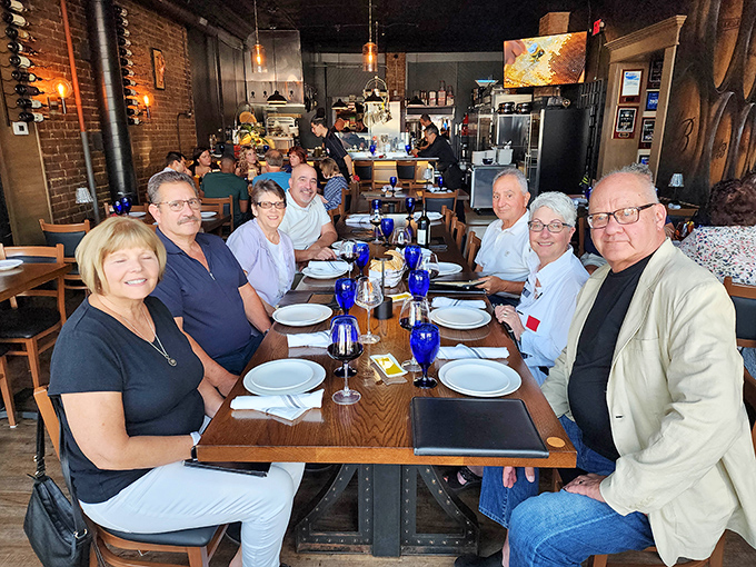 The true test of a great restaurant? Happy diners. These folks look like they've just discovered the secret to life&mdash;and it's on their plates.