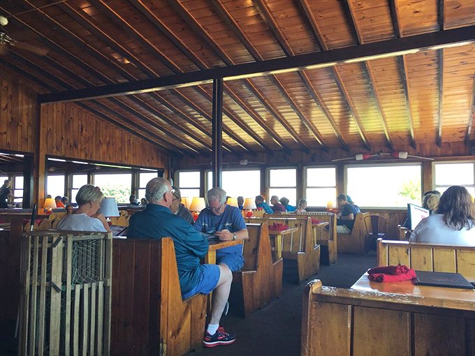 The dining room hums with the satisfied murmurs of patrons who've just discovered what real seafood tastes like &ndash; notice nobody's looking at their phones?