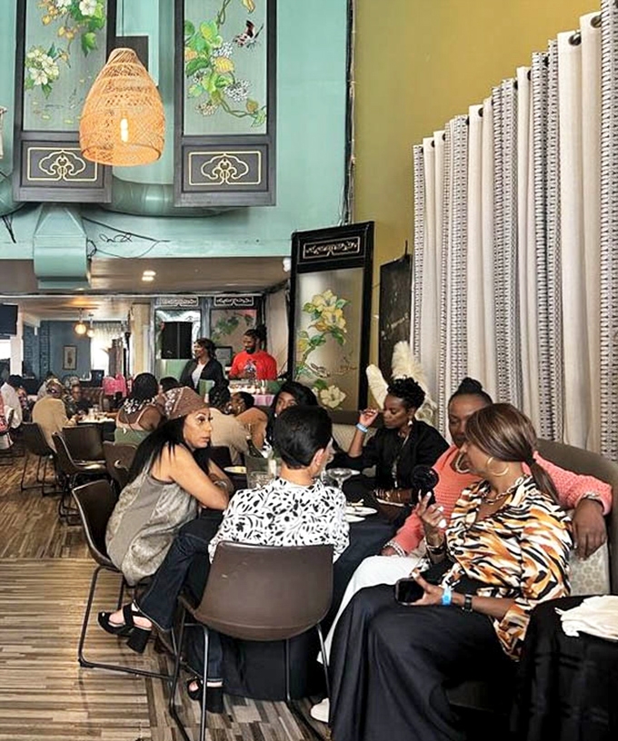 The dining room hums with the universal language of "mmm" &ndash; a place where strangers become friends over sauce-stained napkins.