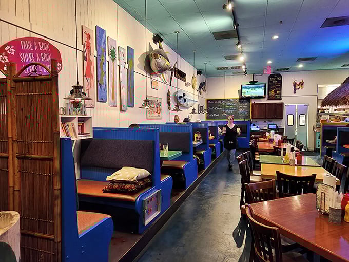 The nautical-meets-beachy dining room features blue booths, fishing d&eacute;cor, and enough coastal charm to forget you're miles from shore.