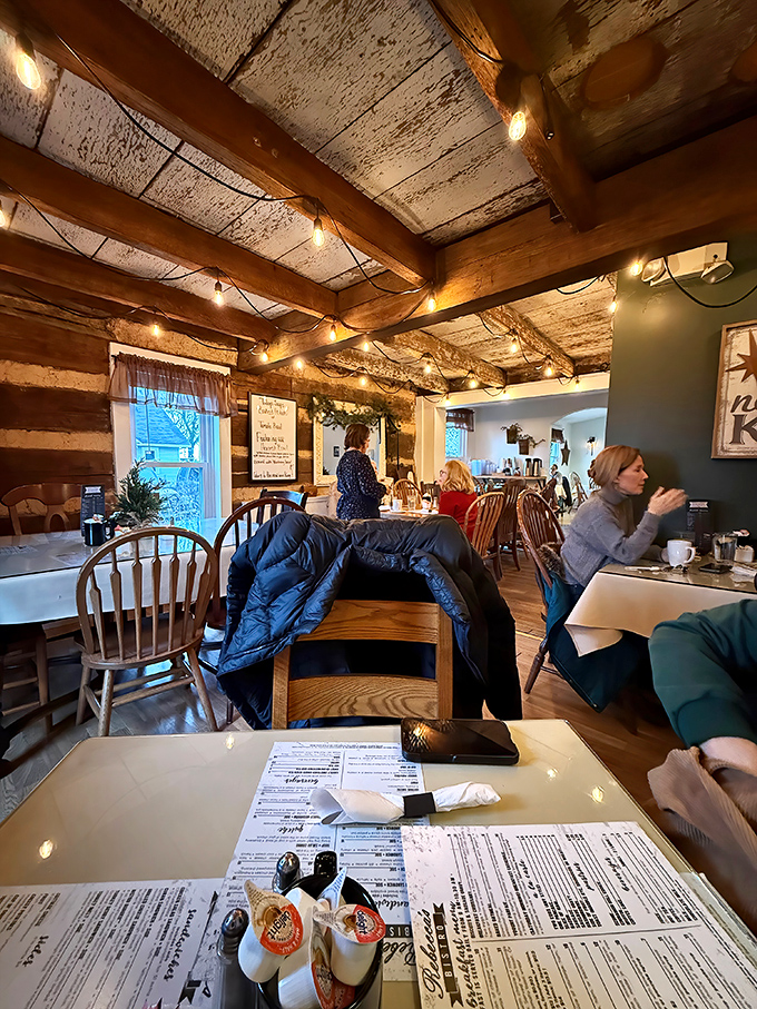 Exposed beams and twinkling lights create an atmosphere so cozy you'll want to claim squatter's rights and never leave.