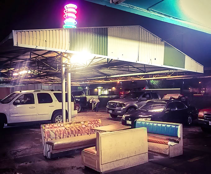 Under the glow of neon, cars gather like worshippers at the altar of comfort food. Some traditions are worth preserving.