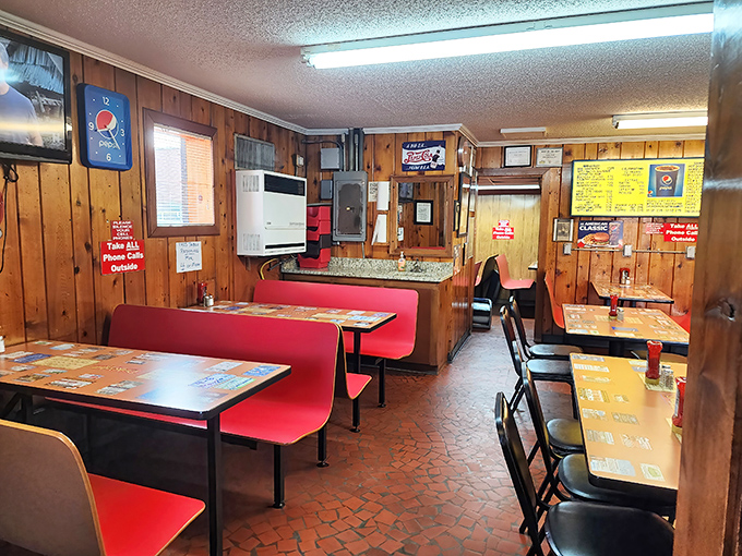 Red booths, wood walls, and fluorescent lighting create the kind of authentic diner atmosphere money can't buy anymore.