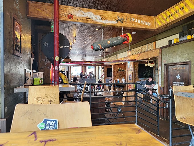 Suspended parachuting bombs and military-inspired decor create a playful "mission control" for your taste buds' next adventure.