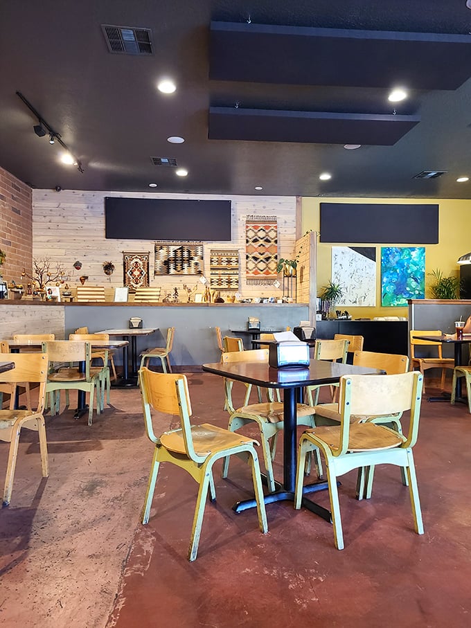 Colorful chairs and southwestern textiles create a dining room where comfort food meets comfort seating in perfect harmony.