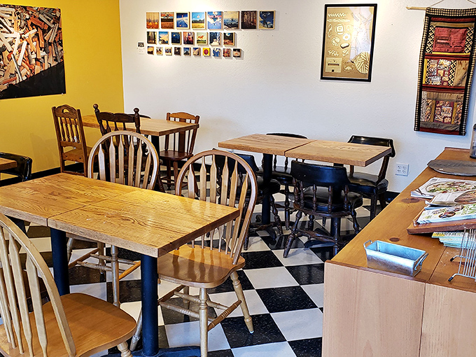 Yellow walls and wooden tables create that "stay awhile" vibe. The kind of place where you accidentally spend three hours talking to strangers.