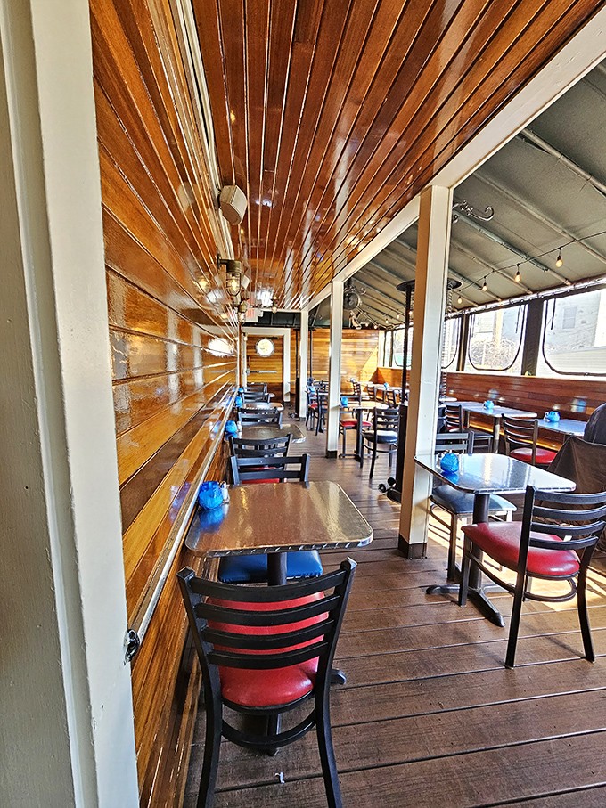 Honey-colored wood paneling and nautical touches create a dining room that feels like eating inside a particularly delicious ship.