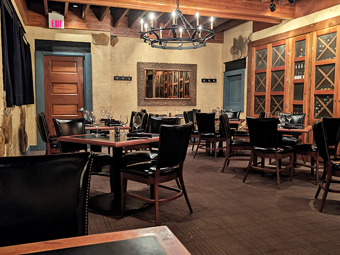 The private dining area whispers "special occasion" without shouting "pretentious." Wood, stone, and leather create a sanctuary for serious eating.