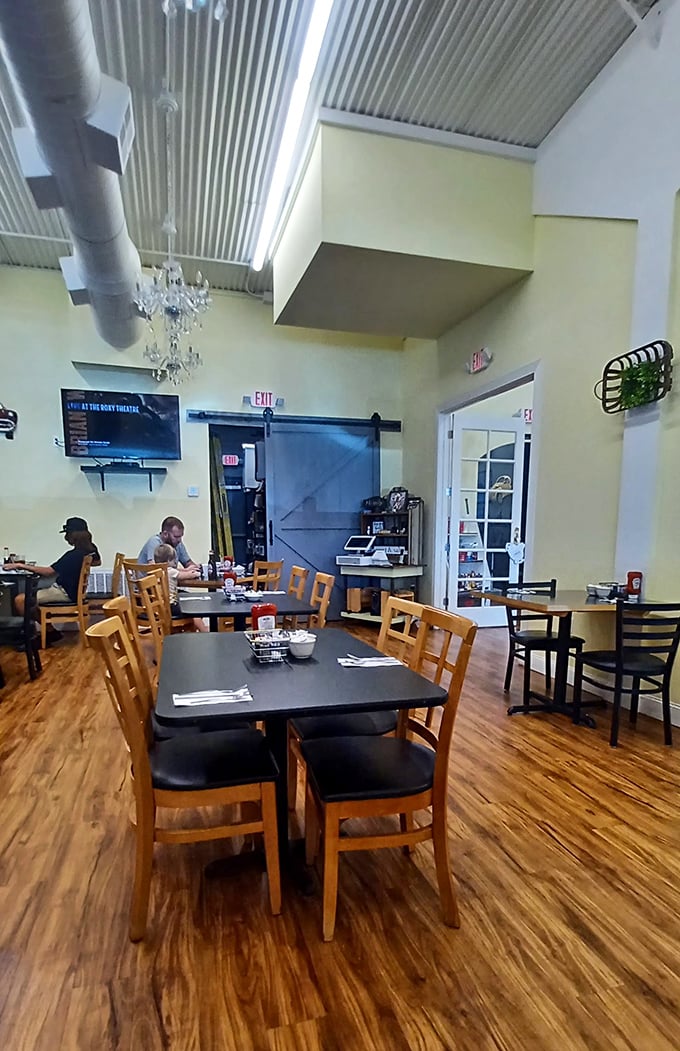 Simple wooden tables, comfortable chairs, and a chandelier that adds just enough whimsy. Fancy without trying too hard.