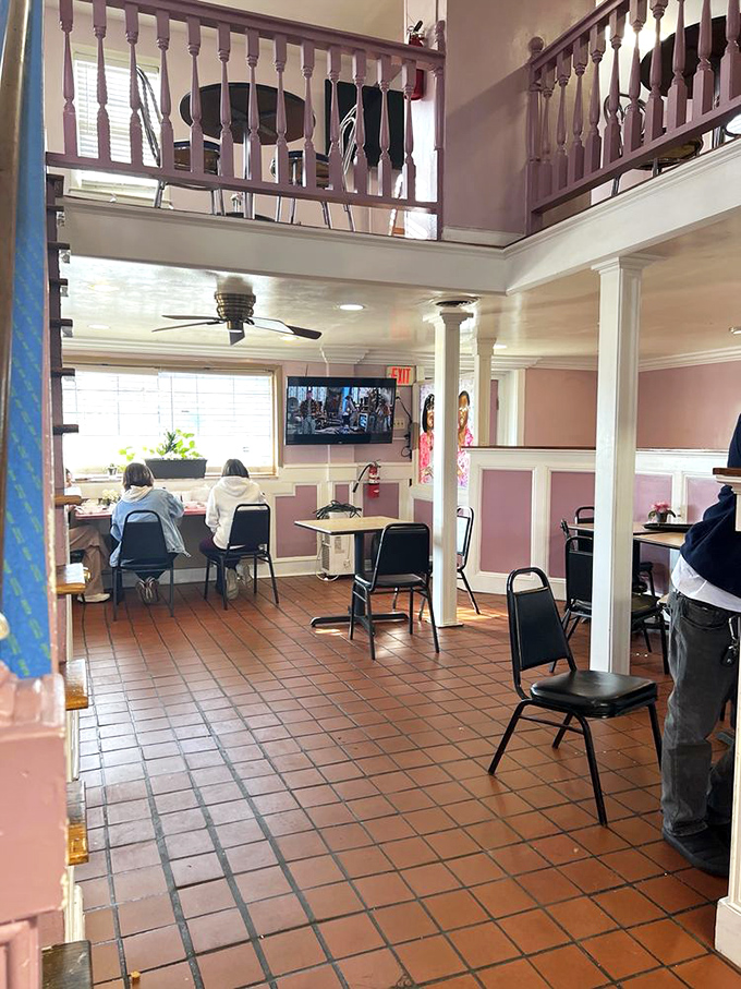 The dining area's terra cotta floors and pink walls create an unpretentious backdrop for the serious business of soul food appreciation.