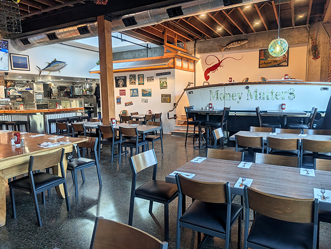 Not just tables and chairs, but front-row seats to seafood theater. Note the boat name "Money Maker" &ndash; either ironic or aspirational, but definitely perfect.