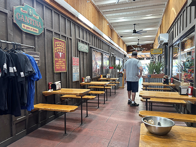 The dining corridor stretches invitingly, where corrugated metal meets comfort food in perfect harmony.