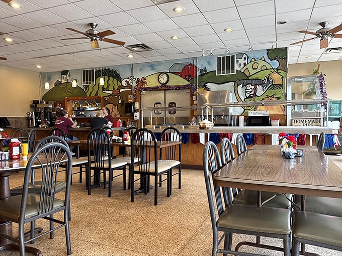 The dining area's farm-themed mural reminds you exactly where your breakfast began its journey to your plate.