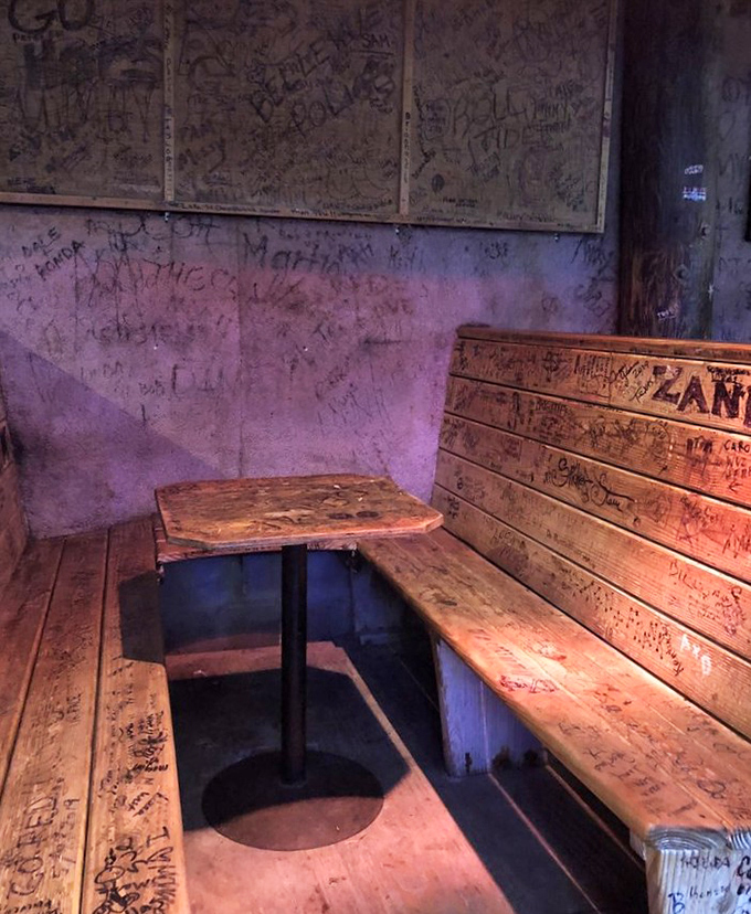 Every inch of wall and wood bears witness to visitors past&mdash;this booth has heard more confessions, celebrations, and bad jokes than a seaside therapist.