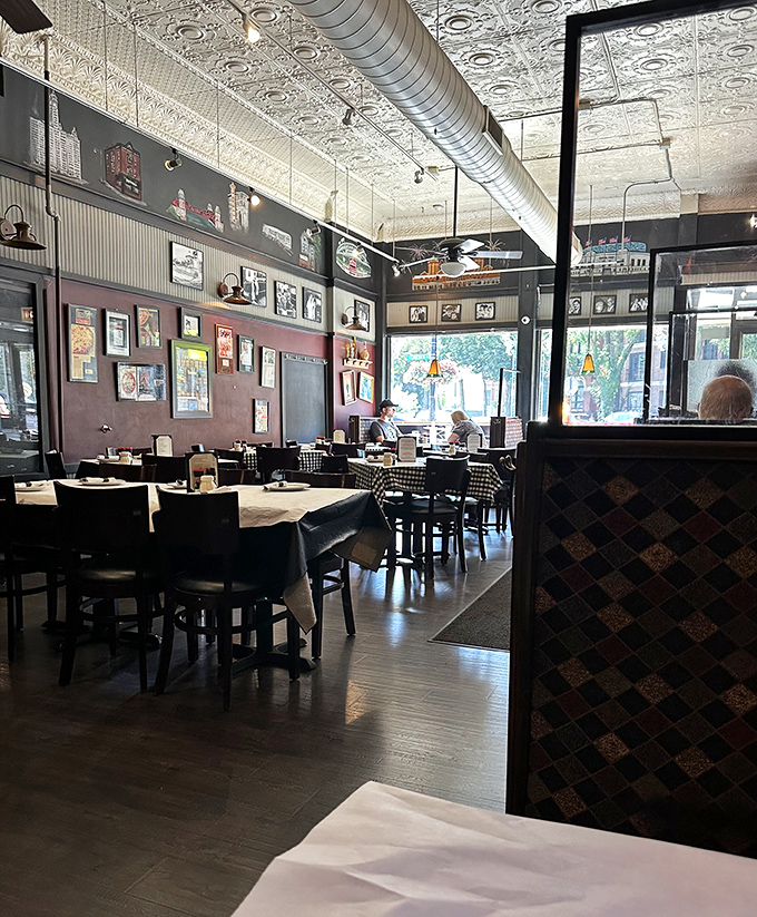 The dining room's pressed tin ceiling and warm lighting create the kind of atmosphere money can't buy and designers can't fake.
