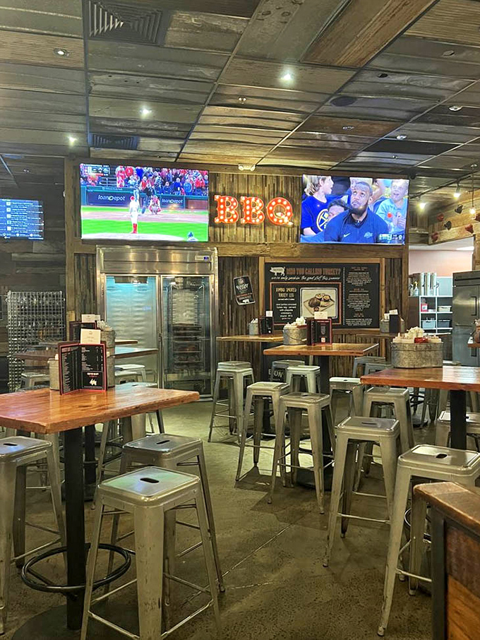 The dining area's illuminated "BBQ" sign serves as both decoration and spiritual guidance for hungry patrons seeking smoky salvation.