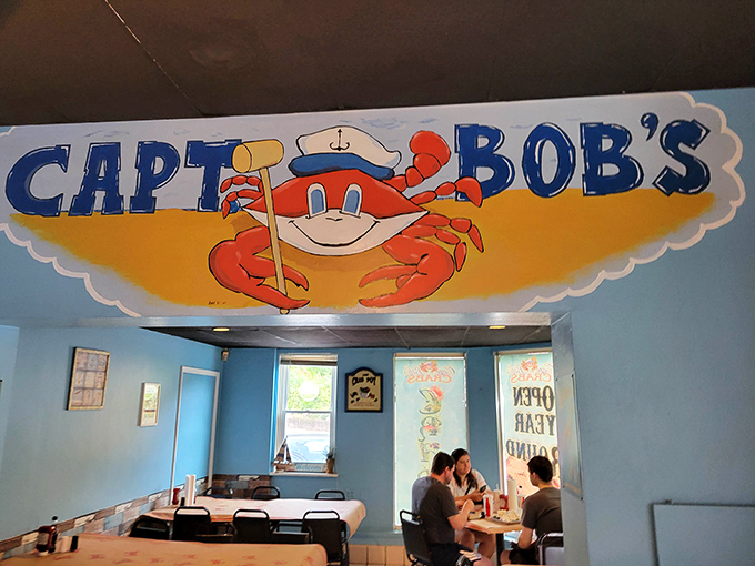 The cheerful Captain Bob's sign watches over diners like a benevolent maritime guardian, ensuring everyone gets their proper seafood fix today.