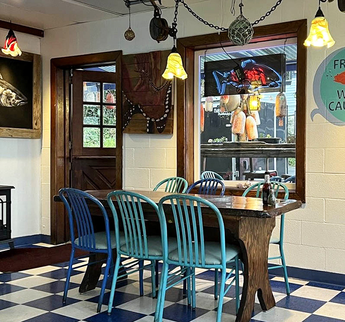 Nautical blues meet checkered floors in a dining room that feels like your cool uncle's beach house.