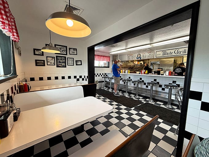 White booths, pendant lights, and a counter view&mdash;the classic diner trifecta that's become rarer than a politician turning down a free meal.