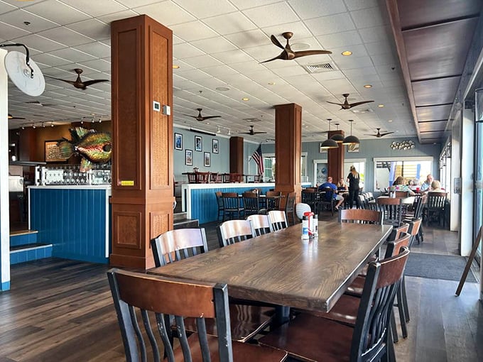 Clean lines, coastal blues, and wooden accents create the perfect backdrop for seafood feasting without any pretension.
