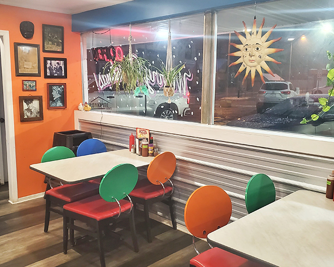 The dining area's kaleidoscope of colors and sun-face window art creates the feeling you've stepped into an artist's interpretation of happiness.