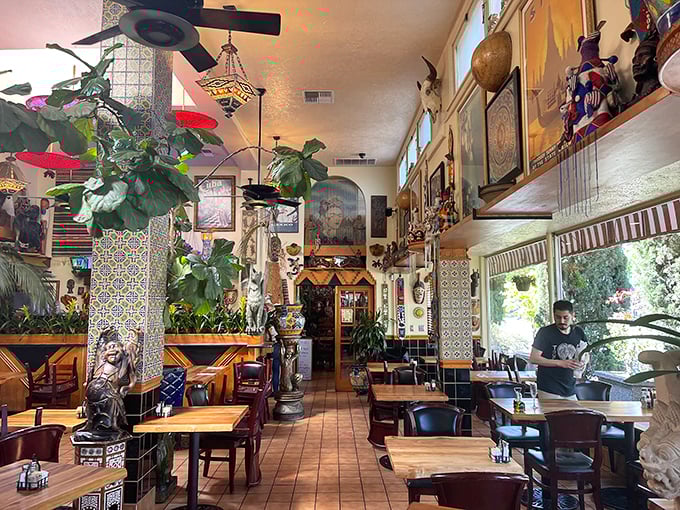 Plants don't just decorate this space—they're practically co-diners in a room where every corner tells a different cultural story.