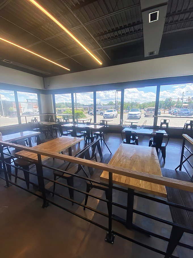 Floor-to-ceiling windows flood the dining area with natural light, creating the perfect stage for the star of the show: that chicken.