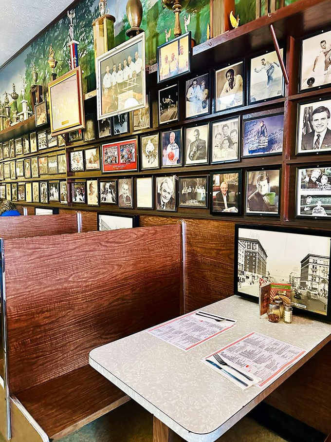 The wall of memories tells Luigi's story better than words could &ndash; decades of community connections framed above wooden booths that have heard it all.