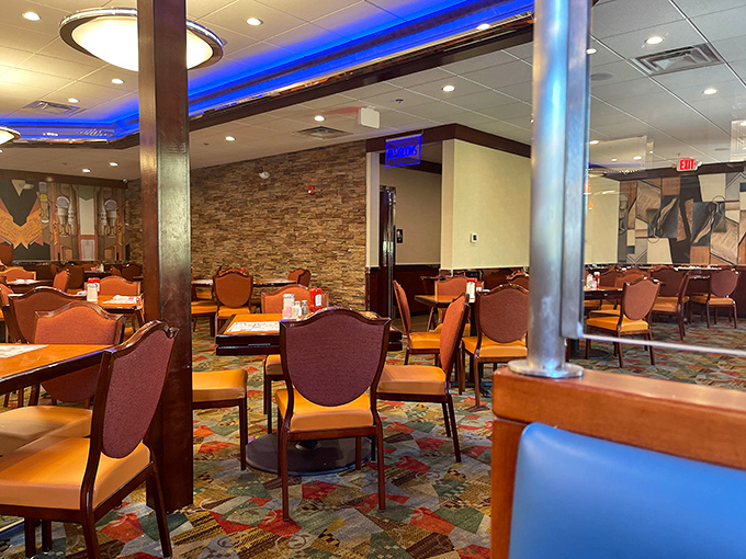 The dining room's blue accent lighting creates an atmosphere that says "Yes, this is a diner, but we've got style too."