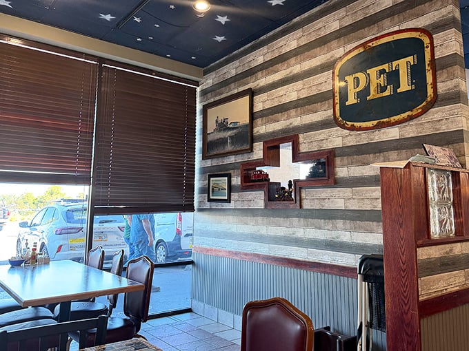 Rustic wood paneling and that signature starry ceiling create the perfect backdrop for the serious business of comfort food consumption.