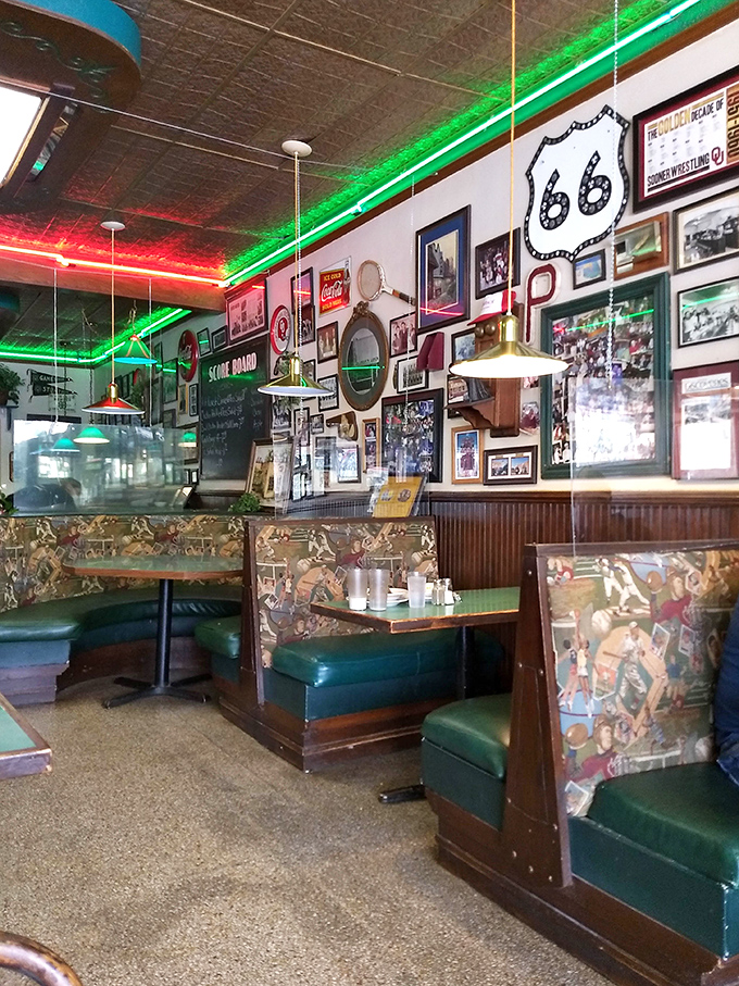 The walls serve as a community scrapbook&mdash;decades of memories, Route 66 memorabilia, and photos of folks who've made this booth "their spot" since Eisenhower.
