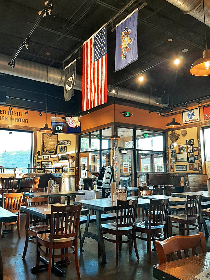 American flags hang proudly above communal seating where strangers become friends bonding over their mutual appreciation for properly smoked meats and sweet tea.