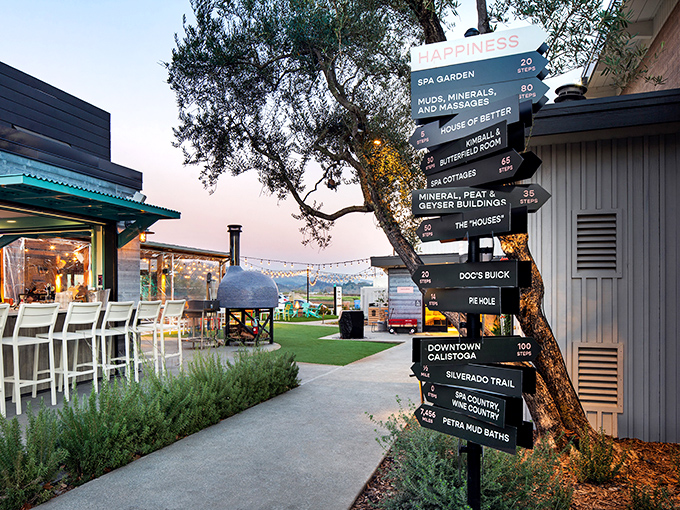 This directional sign is less navigation tool and more life menu &ndash; offering paths to happiness, relaxation, and mud baths all within walking distance.