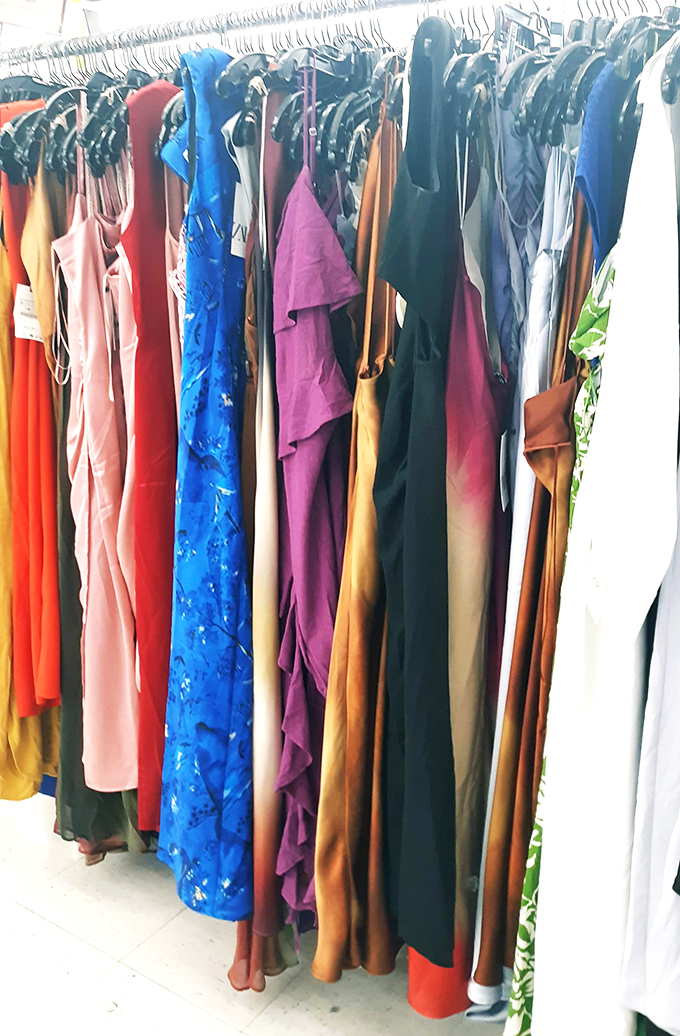 The formal dress section: a rainbow of second-chance elegance. That electric blue number is just waiting for its next night out.