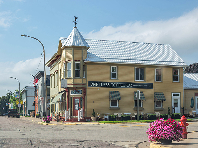 Driftless Coffee Co. anchors this picturesque corner with the promise of caffeine and community&mdash;the twin pillars of small-town morning rituals.