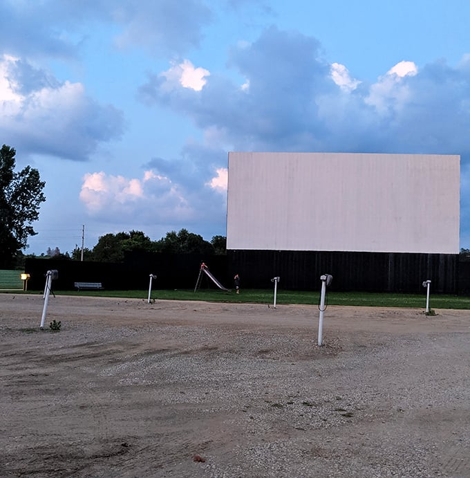 As twilight approaches, the anticipation builds. Empty screens hold promise of adventures about to unfold when darkness finally arrives.