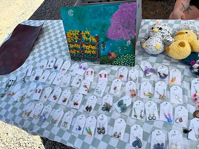 Handcrafted earrings catch the light and shoppers' eyes. Each pair holds the promise of being that perfect conversation starter at dinner.