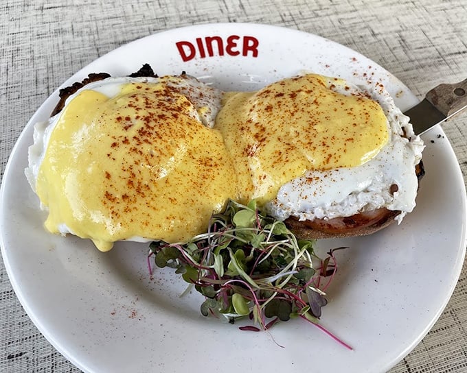 Eggs Benedict that belongs in the breakfast hall of fame. That hollandaise sauce isn't just poured&mdash;it's draped like a golden cape over poached egg superheroes.